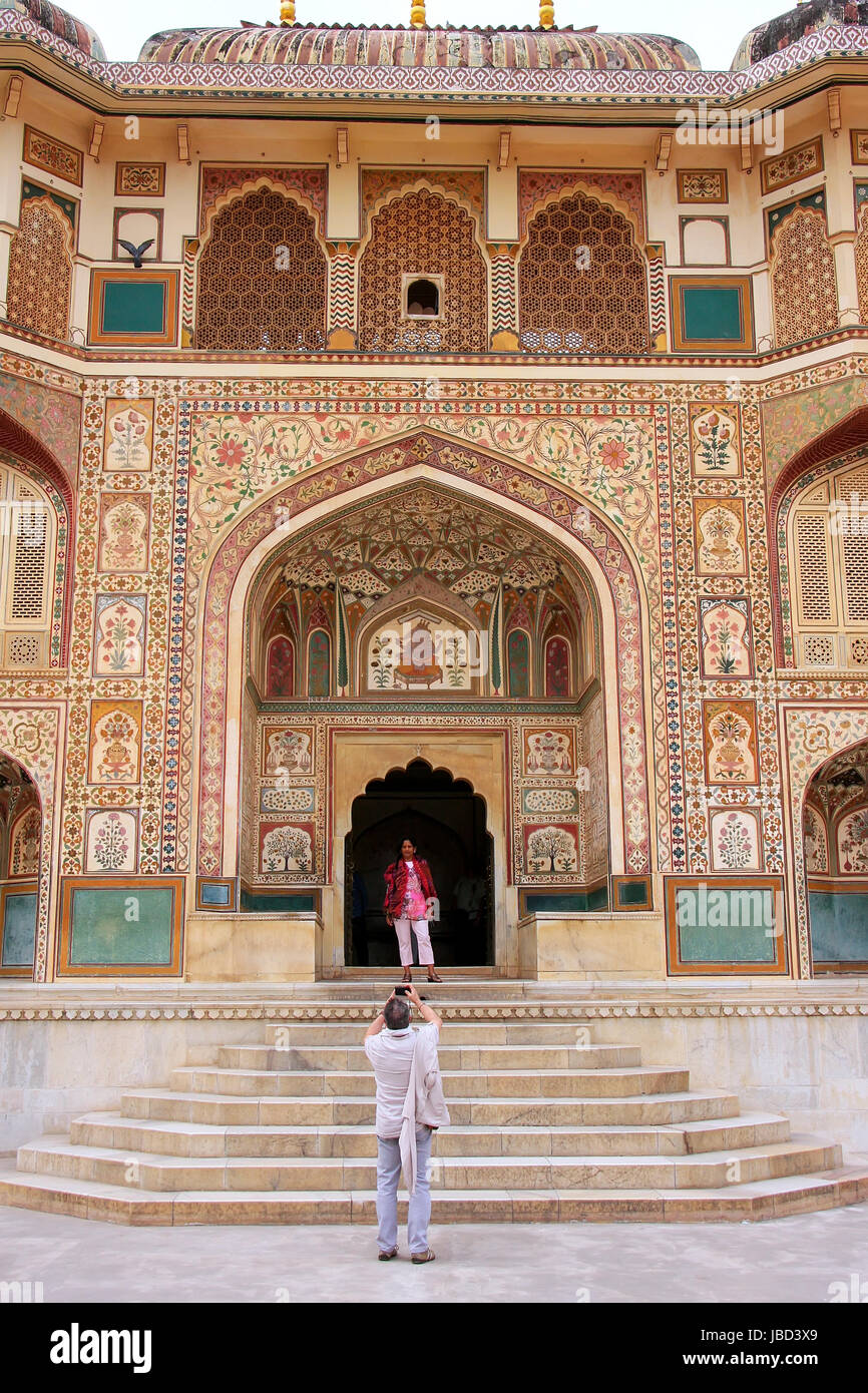 Tourists taking photos at Ganesh Pol in Amber Fort near Jaipur ...