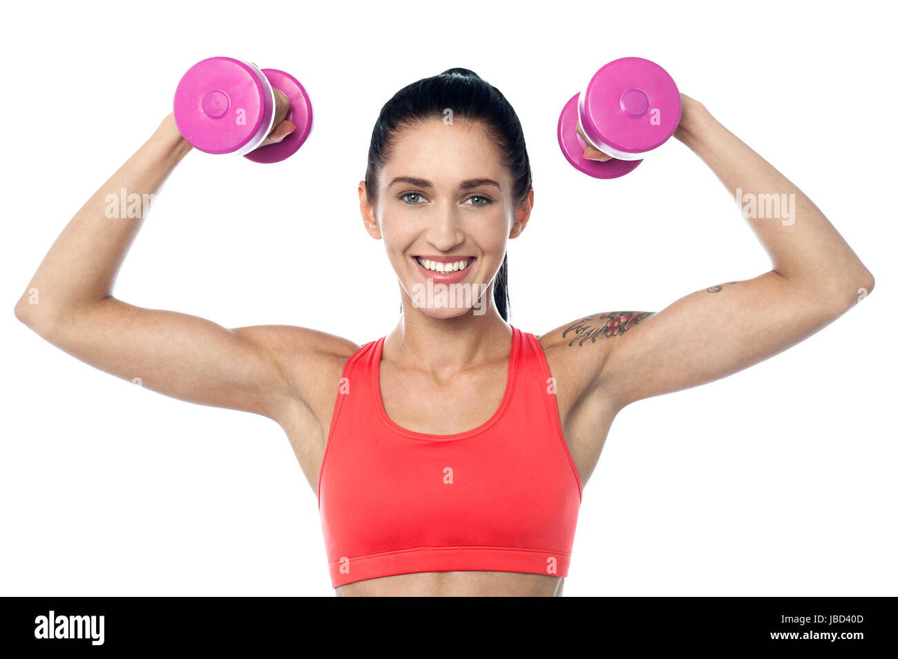Slim athletic lady flexing her biceps Stock Photo - Alamy