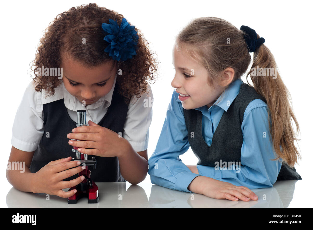 School girls using a microscope in lab Stock Photo - Alamy