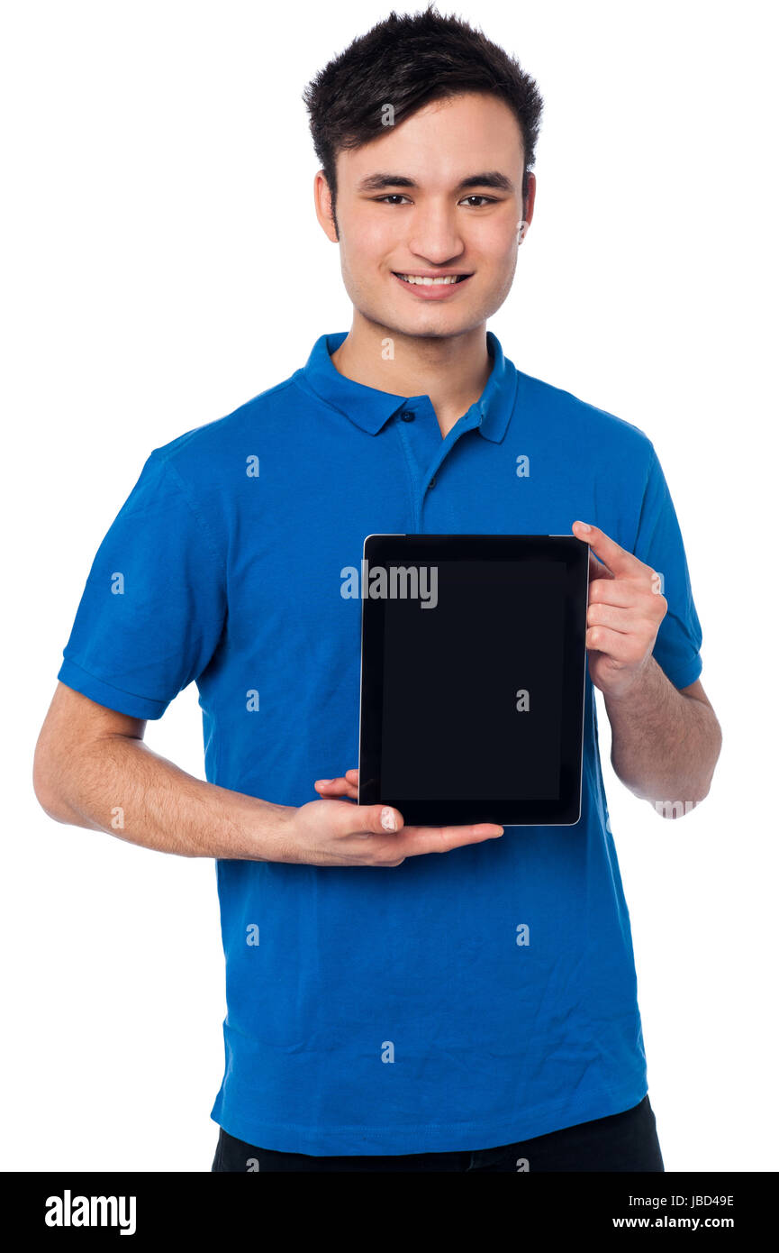 Handsome guy presenting new tablet device Stock Photo - Alamy