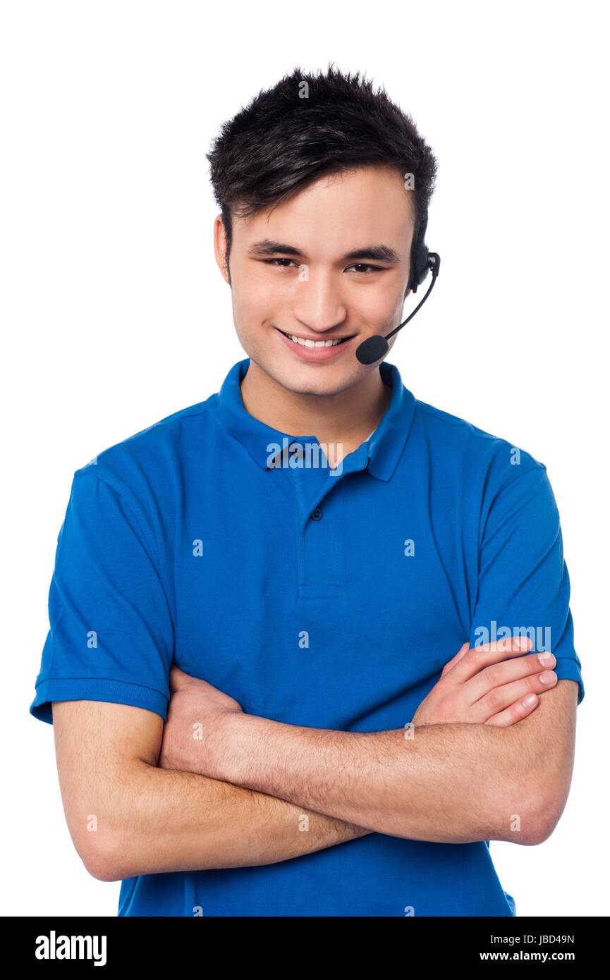 Smiling call center agent with microphone arms crossed Stock Photo - Alamy
