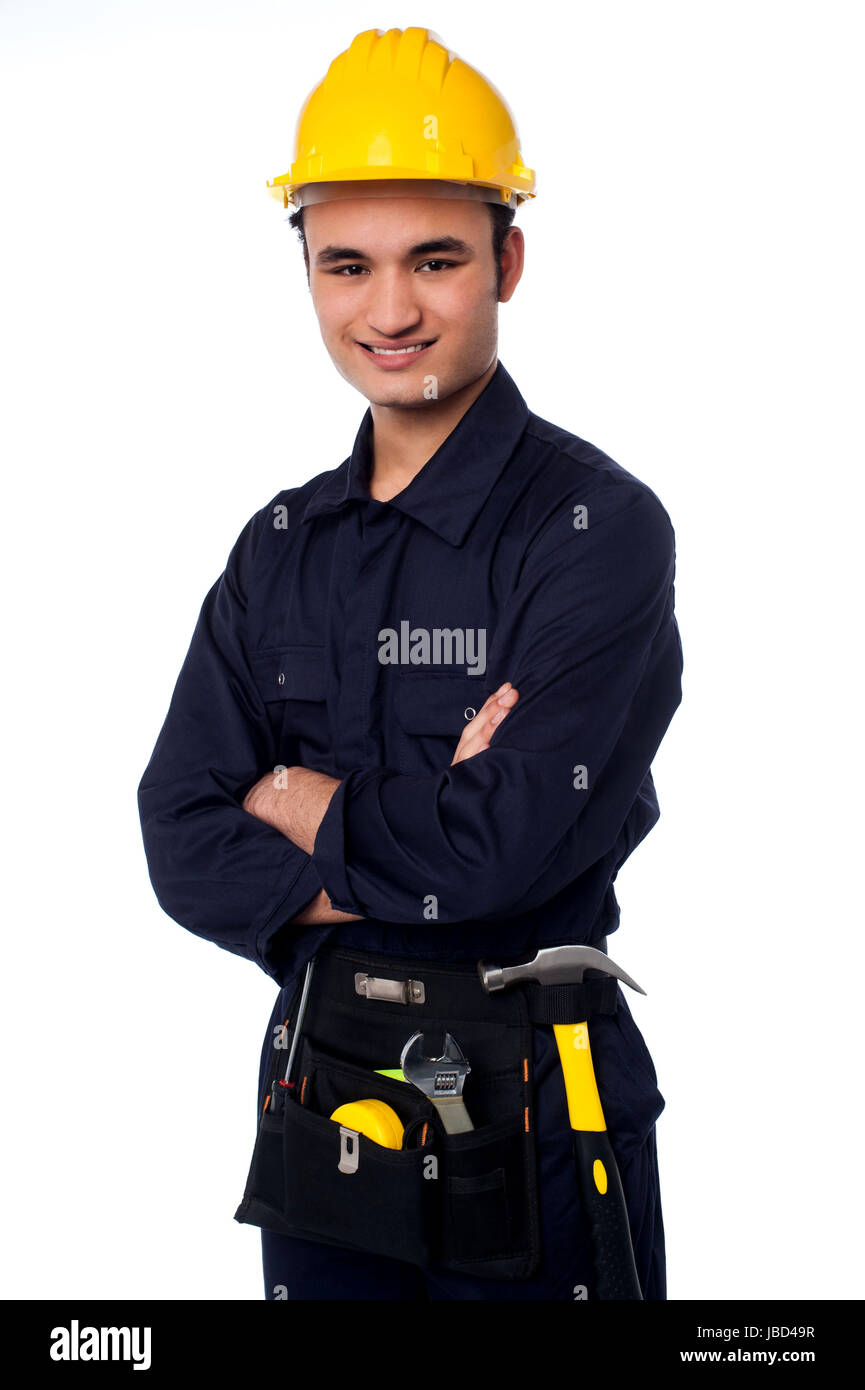 Confident young male worker over white Stock Photo - Alamy