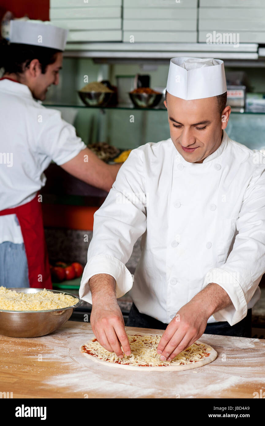 Two young chefs at work. Behind the scenes Stock Photo - Alamy