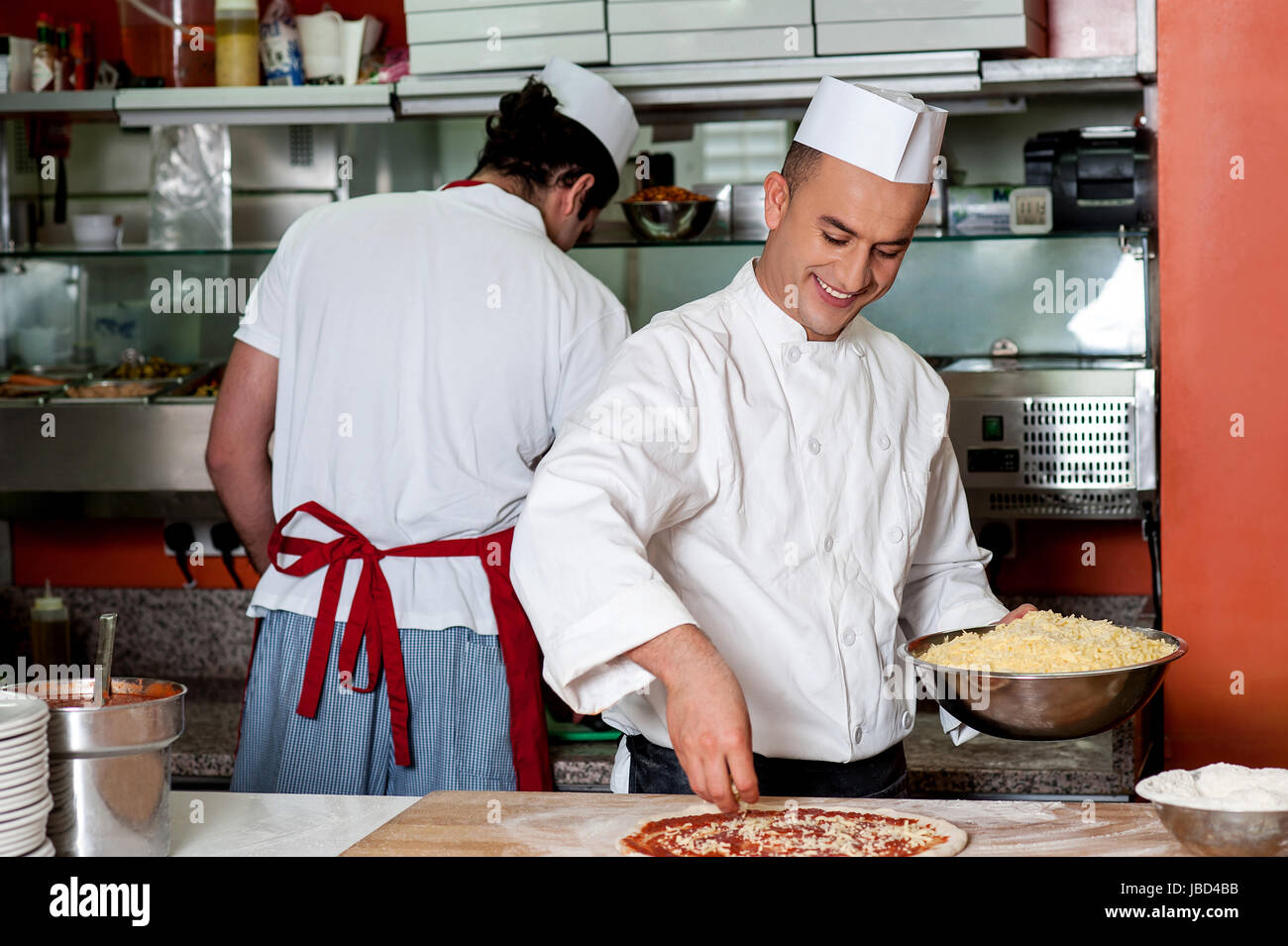 Male chefs working in kitchen, back-office shot Stock Photo - Alamy