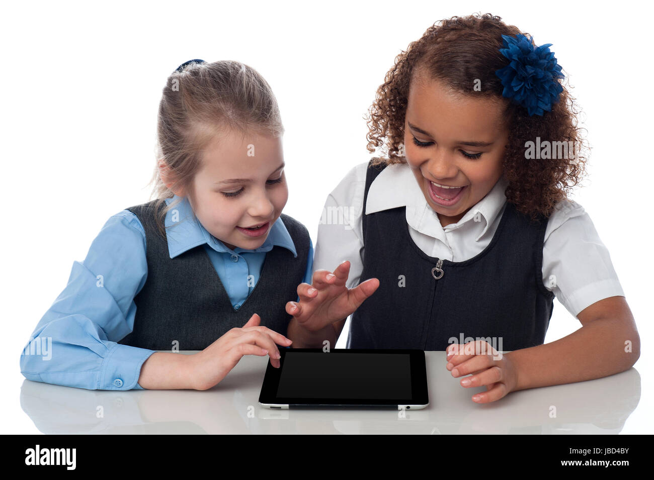 School girls playing on touch pad Stock Photo - Alamy