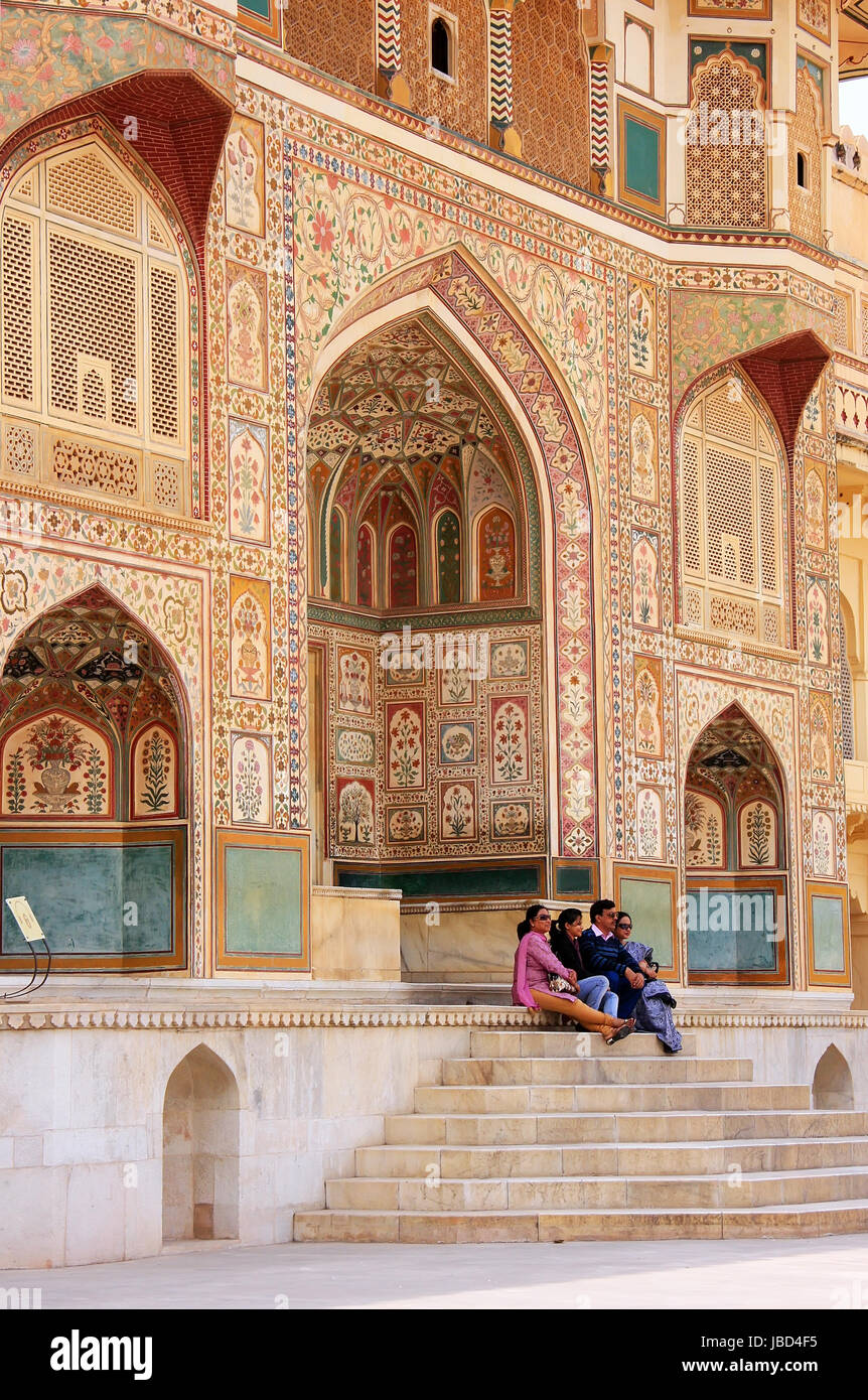Tourists sitting at Ganesh Pol in Amber Fort, Rajasthan, India. Ganesh ...