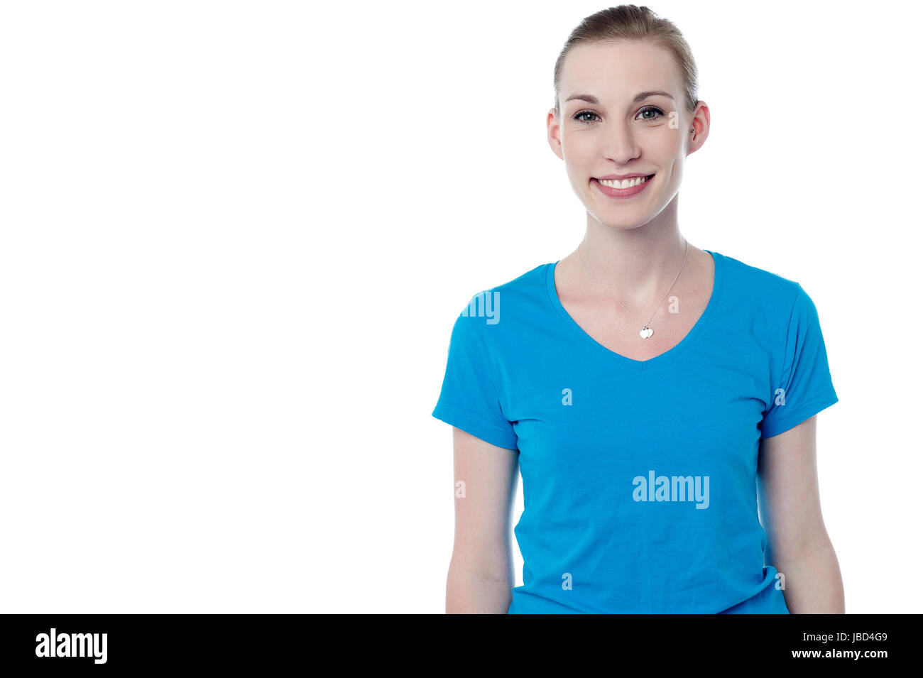 Pretty young girl posing against white background Stock Photo - Alamy