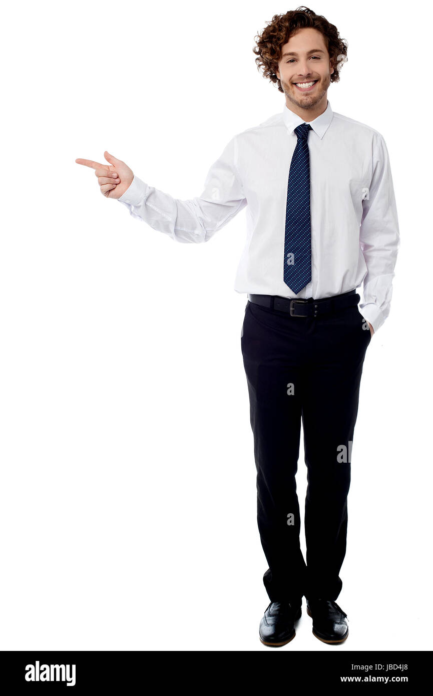 Handsome corporate guy pointing at something Stock Photo - Alamy