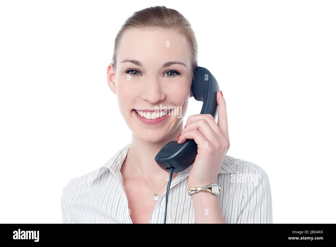 Smiling woman attending customer's call Stock Photo - Alamy