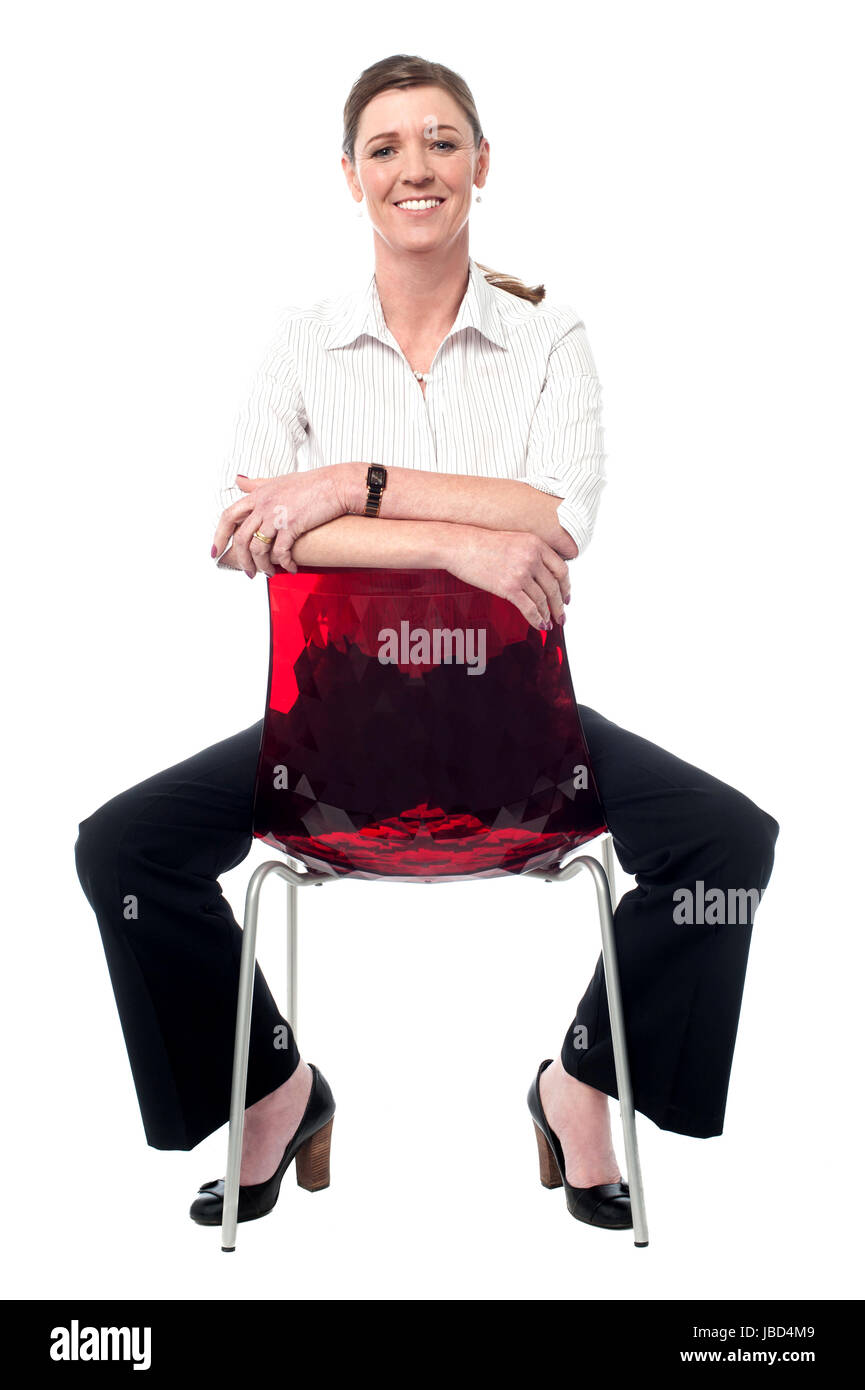 Business lady sitting in stylish posture Stock Photo - Alamy