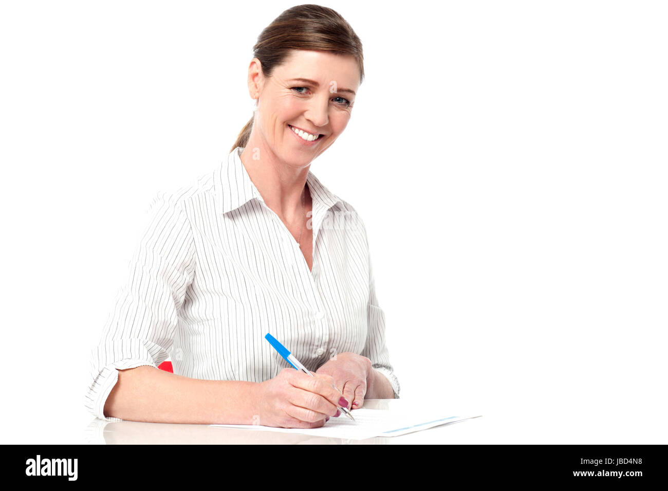 Smiling corporate lady at her work desk Stock Photo - Alamy