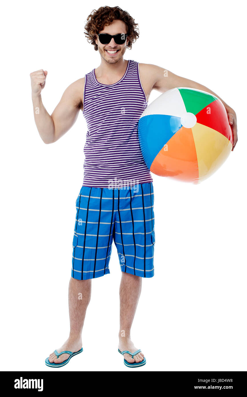 Handsome young guy holding a beach ball Stock Photo - Alamy
