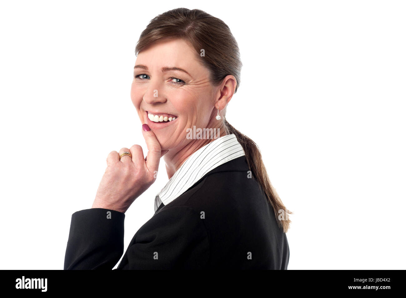 Smiling business lady looking over her shoulder Stock Photo - Alamy