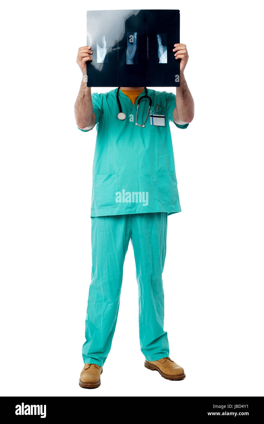 Male physician analyzing x-ray of a patient Stock Photo - Alamy