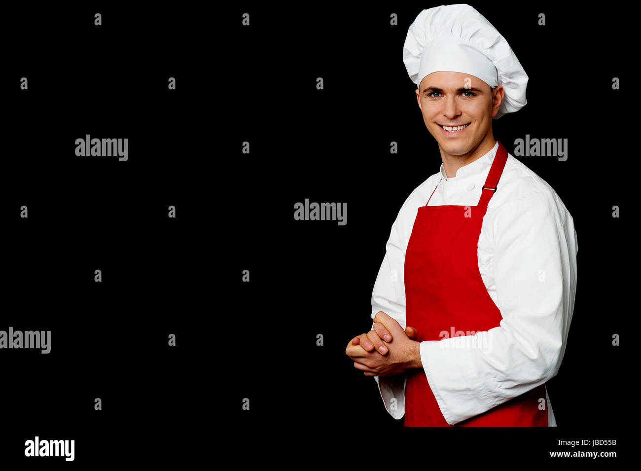 Confident chef man is standing wearing a uniform and hat hi-res stock ...