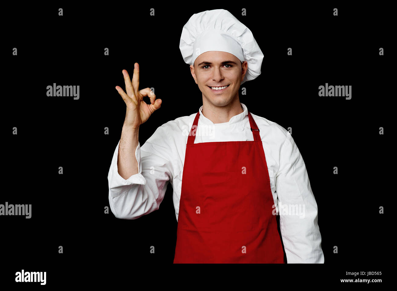 Cheerful chef showing perfect gesture Stock Photo - Alamy