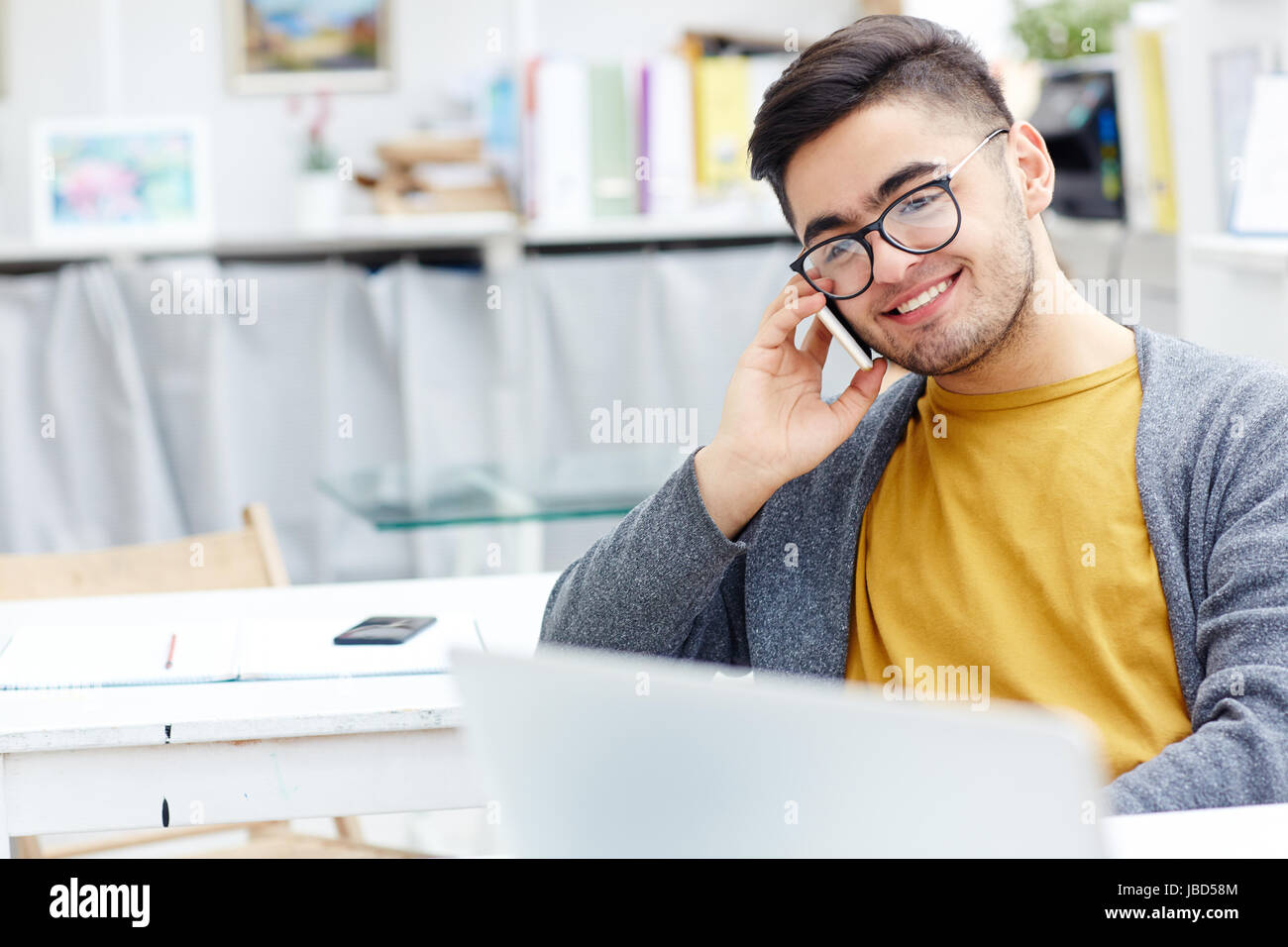 Busy guy talking on smartphone while browsing in the net Stock Photo ...