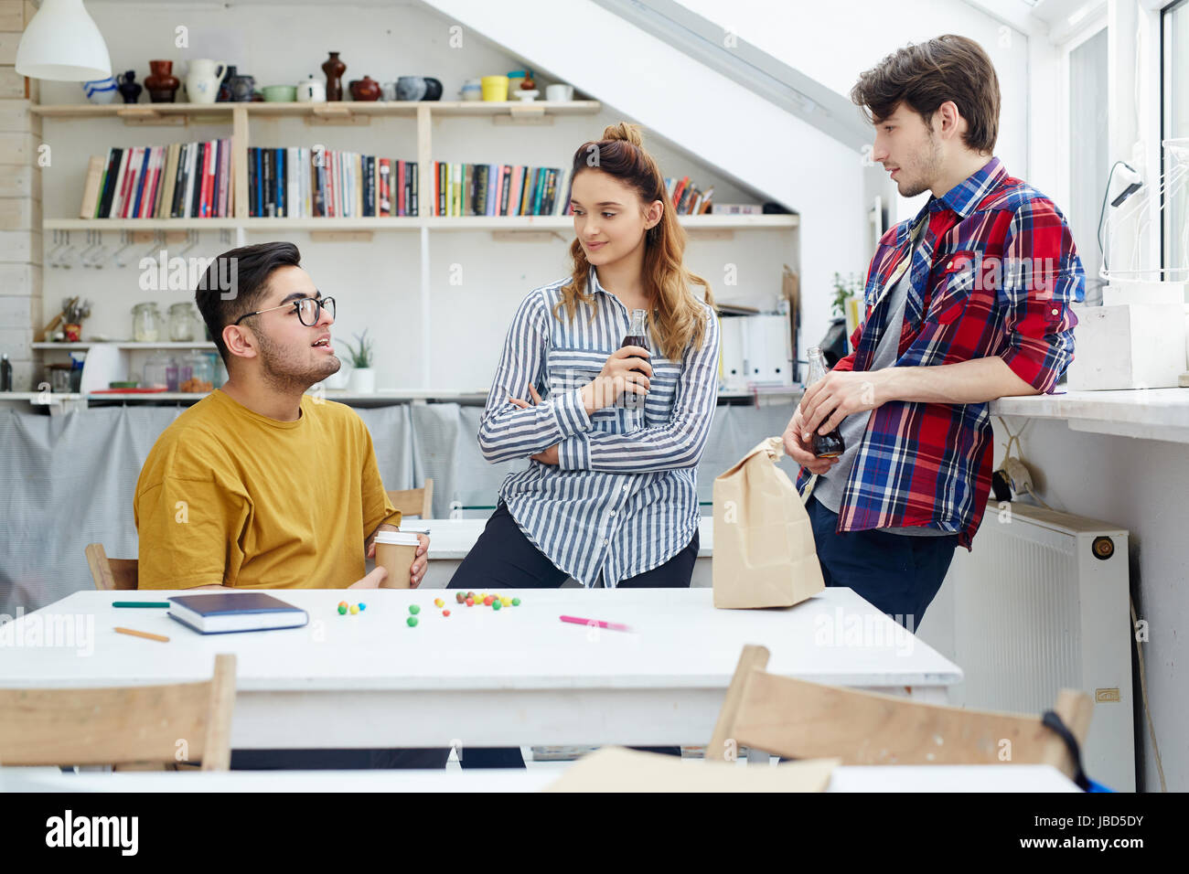 Group of young friends having coffee break in classroom Stock Photo - Alamy