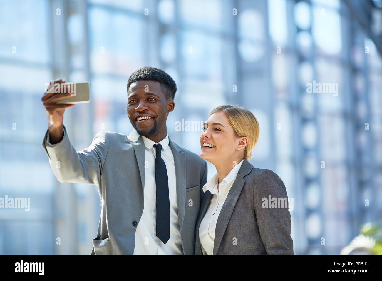 Friendly colleagues making selfie at break Stock Photo - Alamy