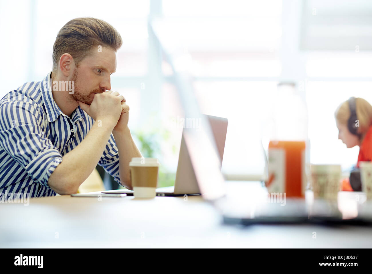 Pensive businessman concentrating on work Stock Photo - Alamy
