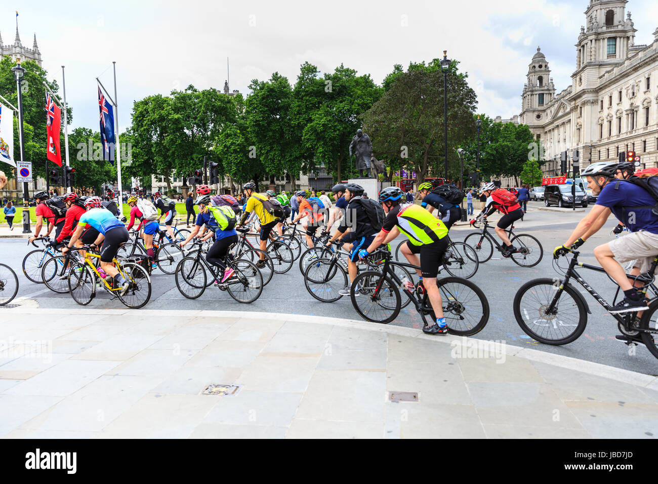 Large group of cyclists and cycling commuters in Parliament Square ...