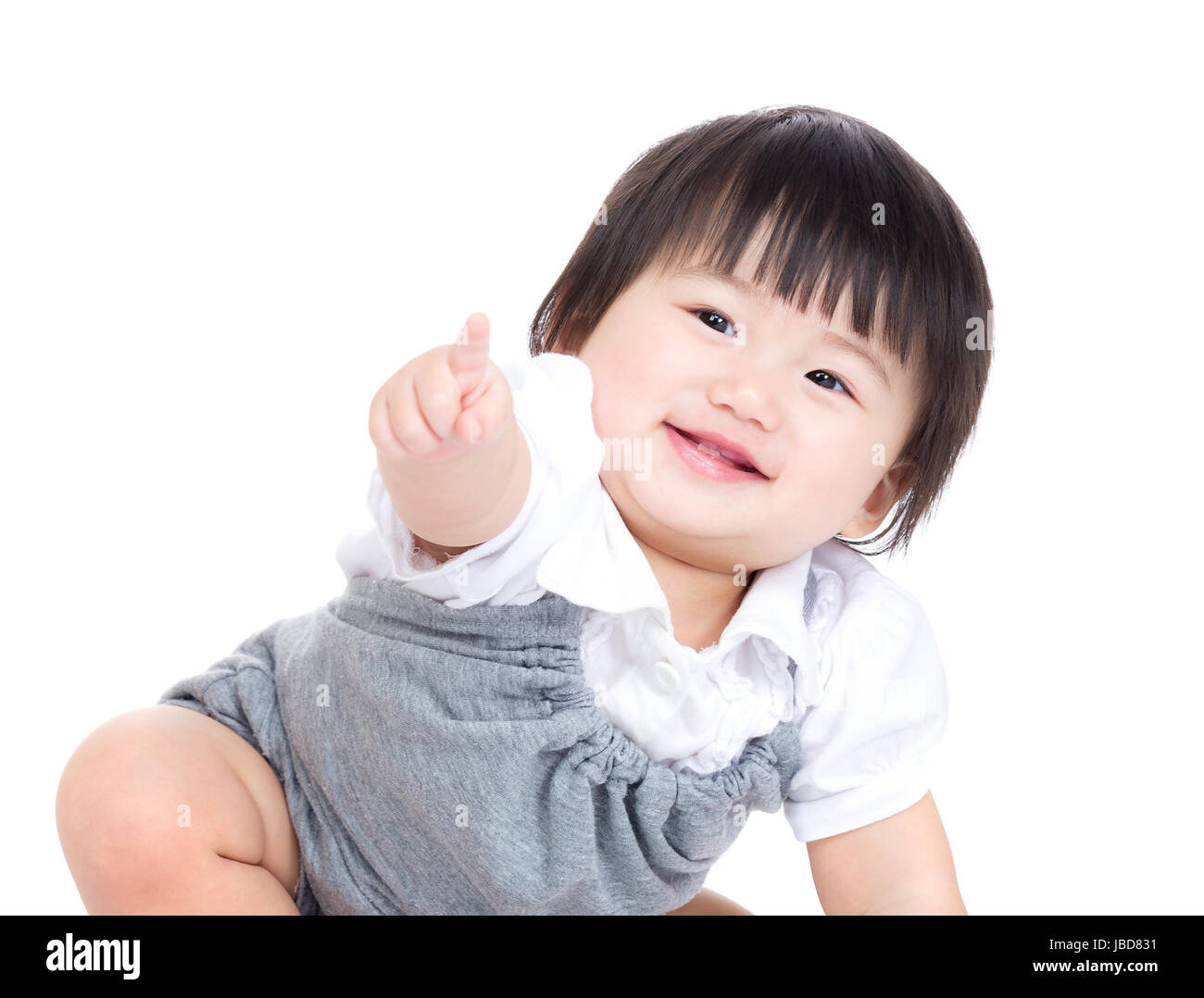 Asian baby girl finger pointing toward front Stock Photo - Alamy