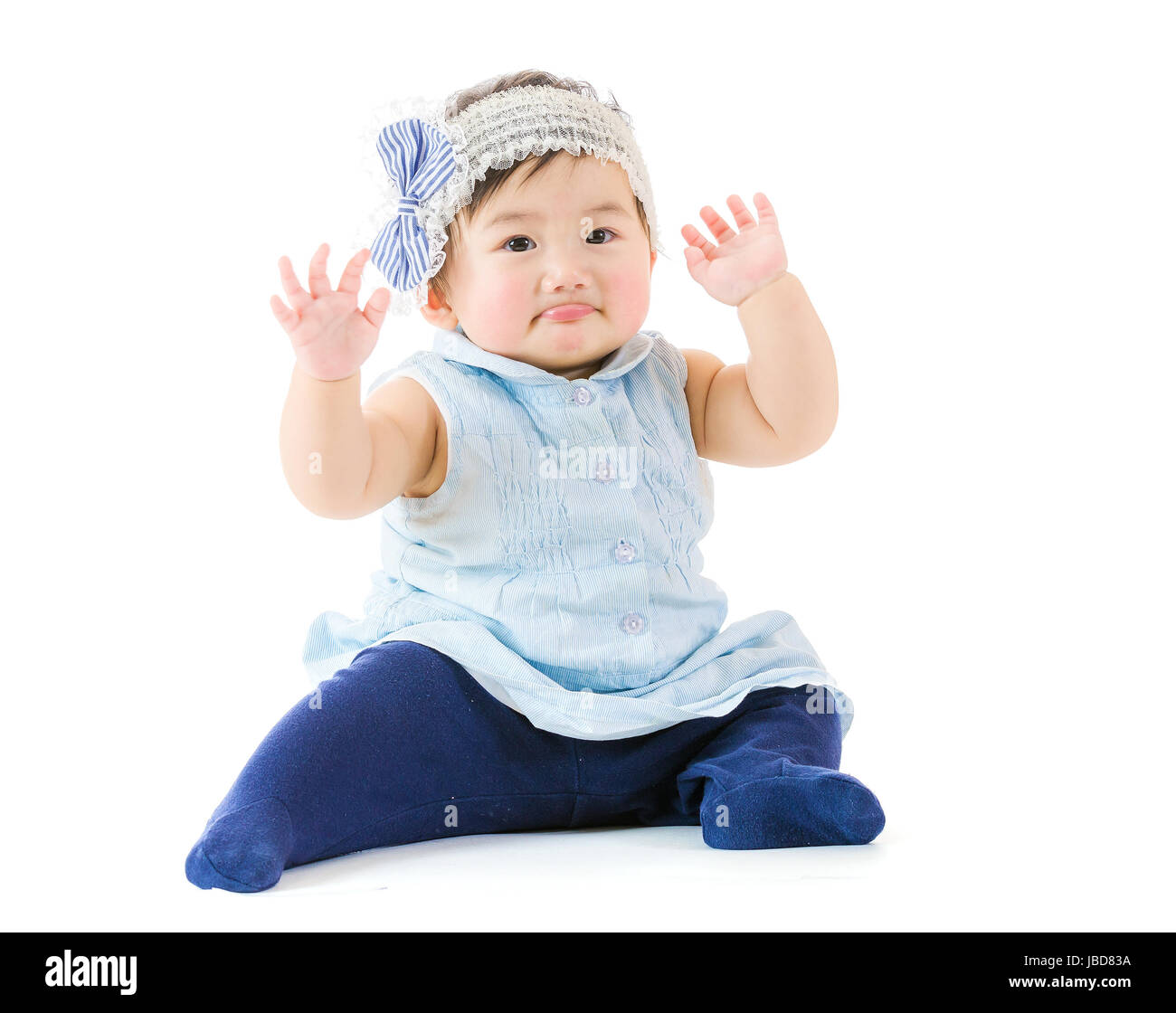 Asian baby girl hand up Stock Photo - Alamy