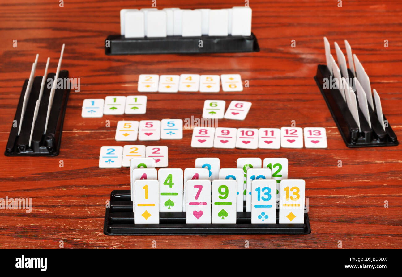 set of tiles in rack during playing in rummy game on wooden board Stock ...