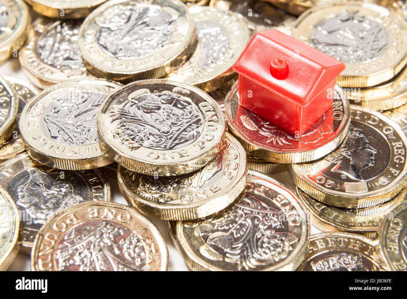 New UK British Pound coins with monopoly houses & hotels Stock Photo ...