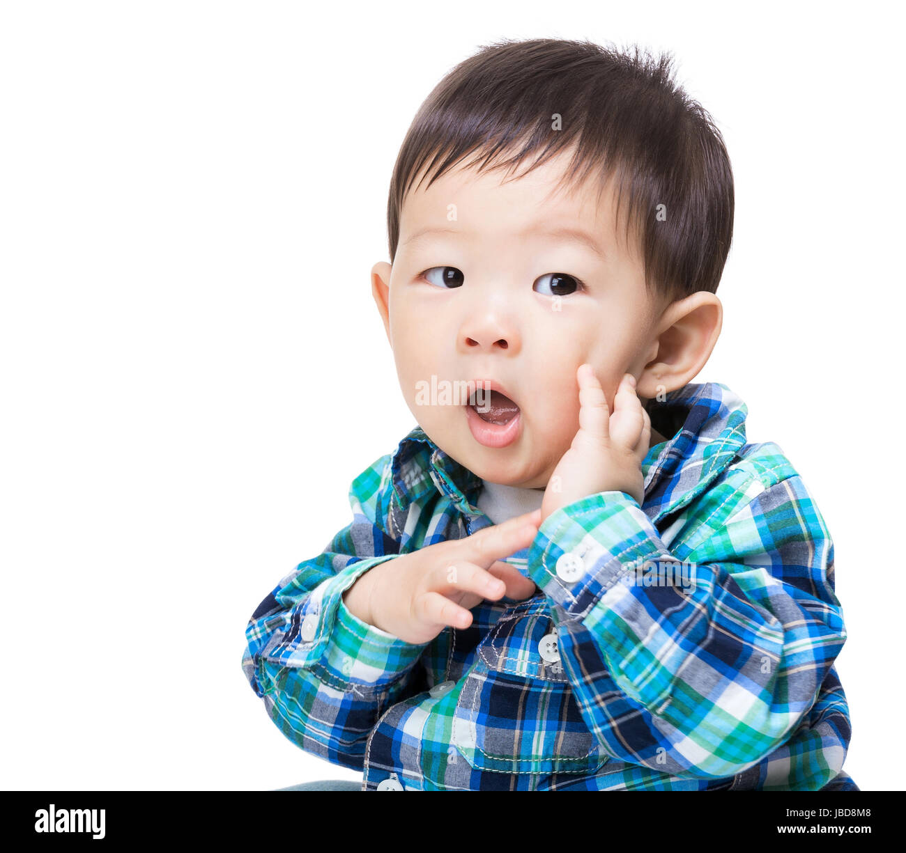 Asia baby boy touch his face Stock Photo - Alamy