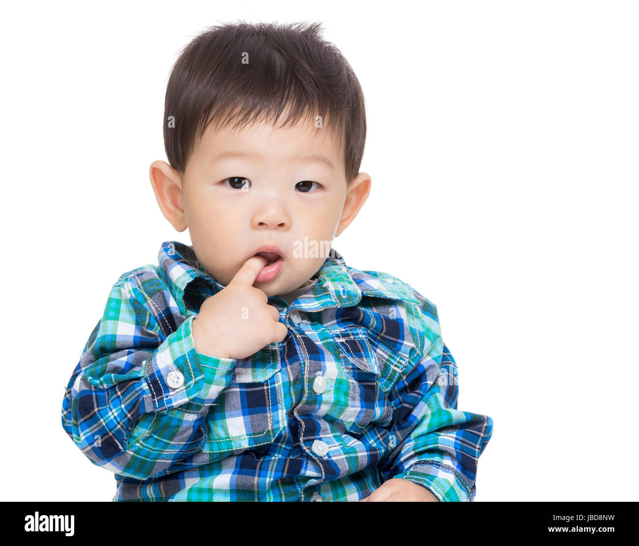 Asian baby boy bite finger Stock Photo - Alamy