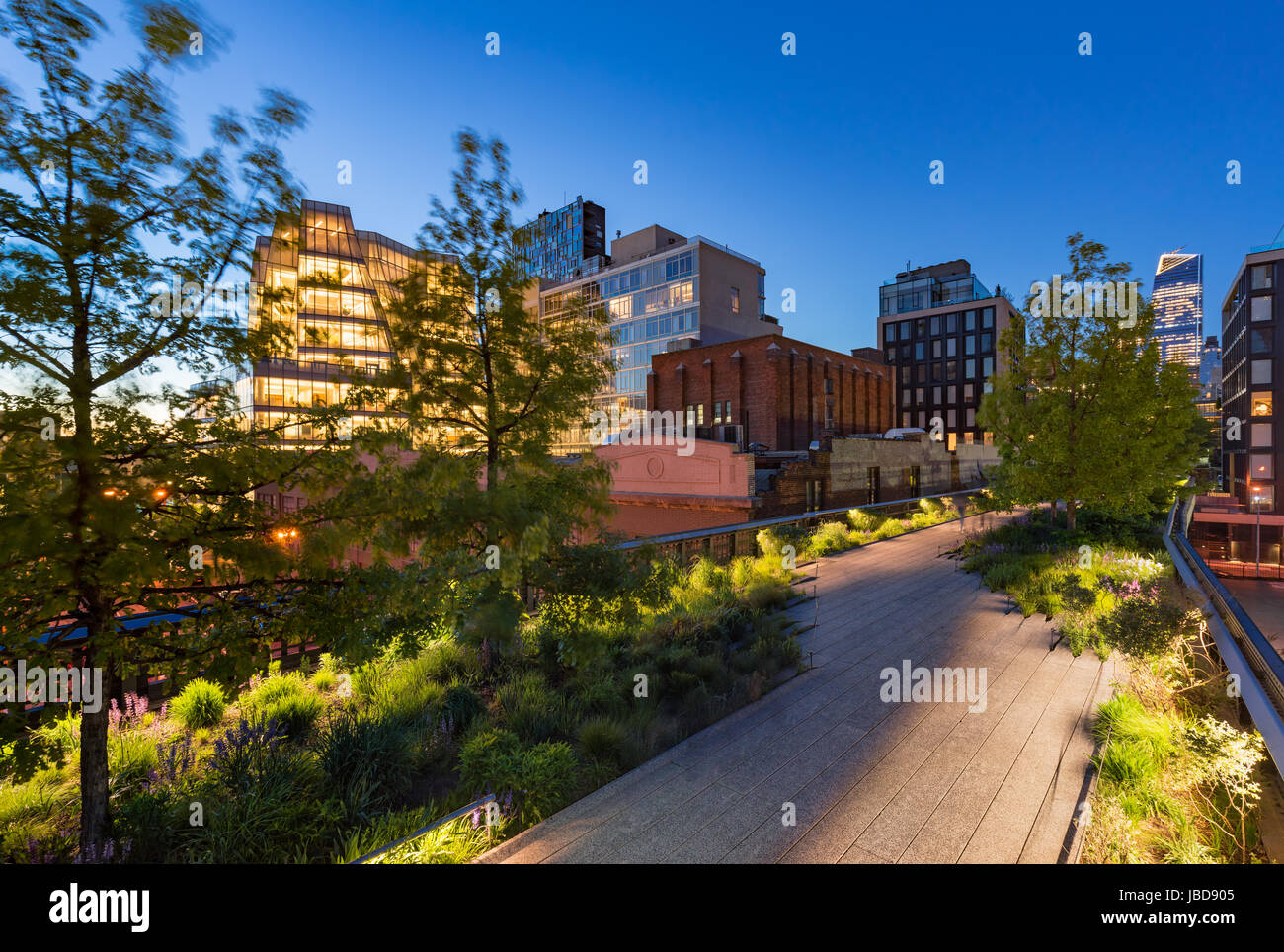 The Highline (High Line Park aerial greenway) at twilight in summer ...