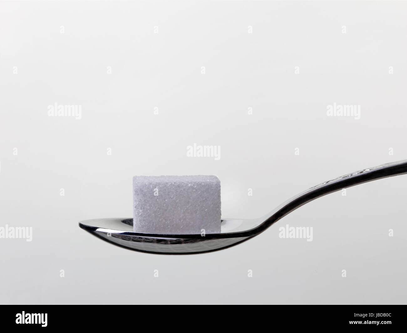 close up of a teaspoon with white sugar, white background Stock Photo ...