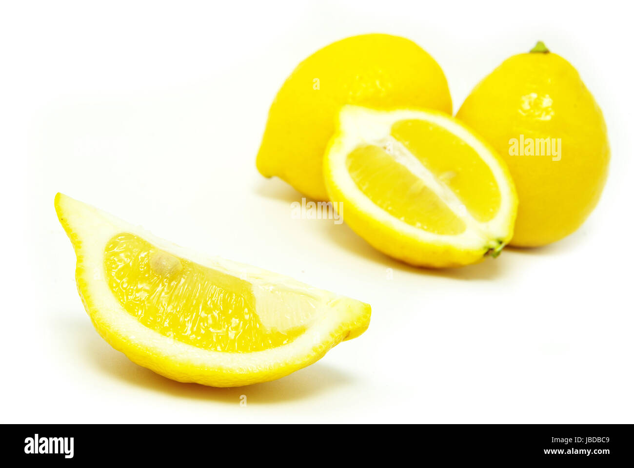 yellow fresh lemons isolated on a white Stock Photo - Alamy