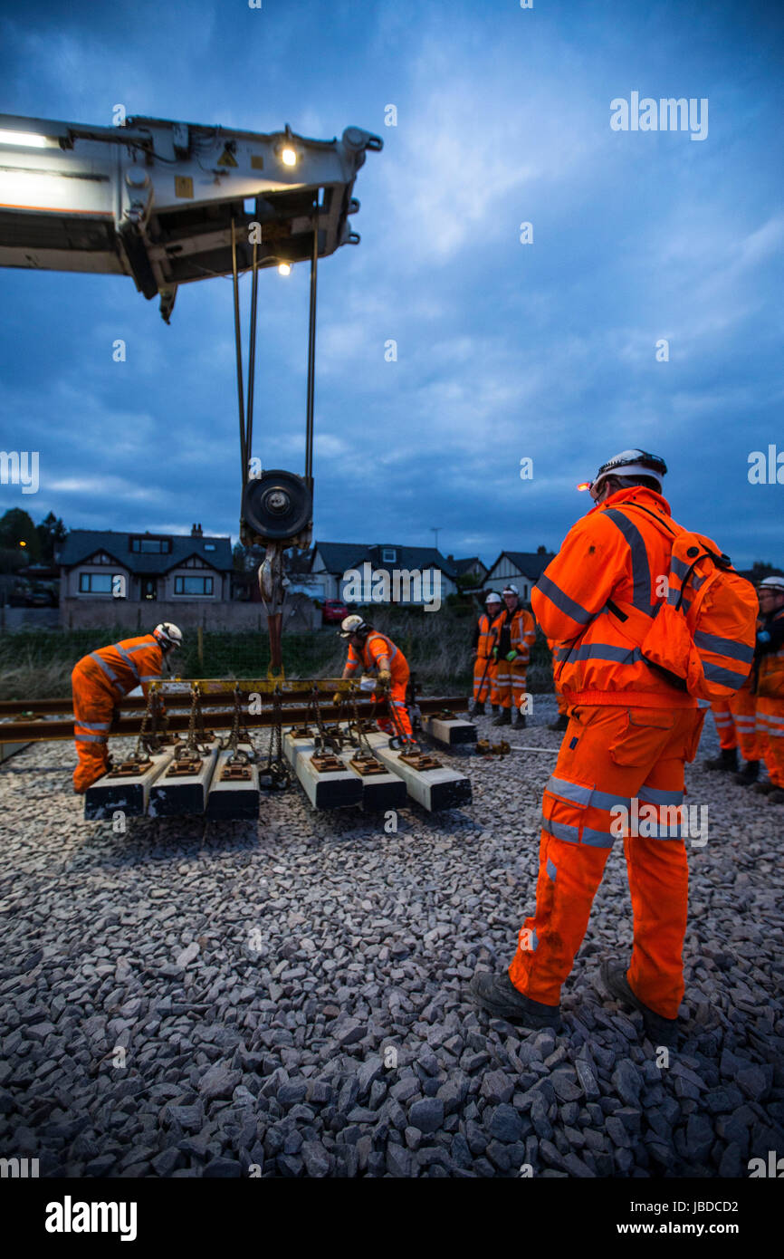 Rail construction workers laying new tracks Stock Photo - Alamy