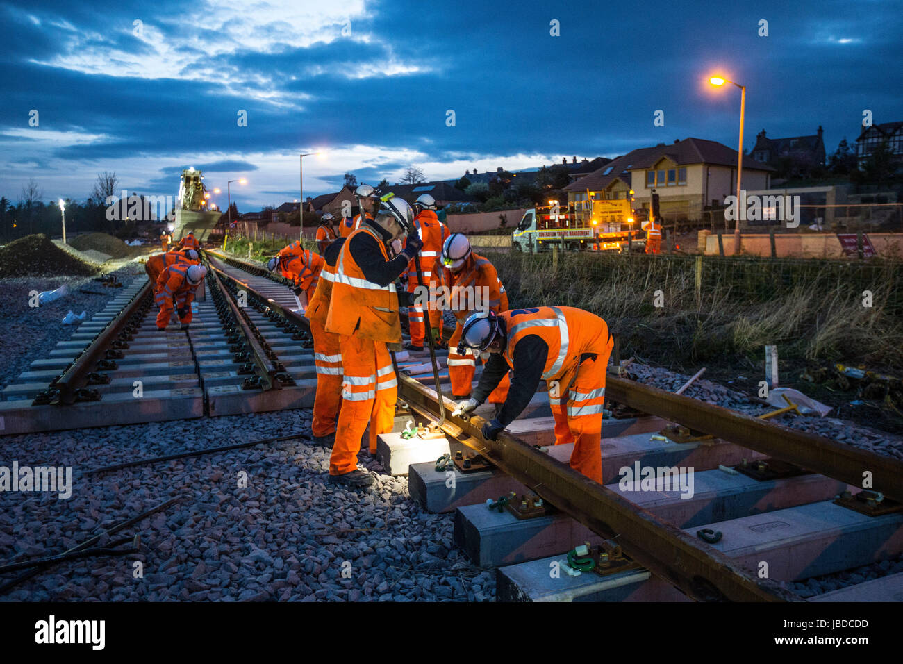 Rail construction workers laying new tracks Stock Photo - Alamy
