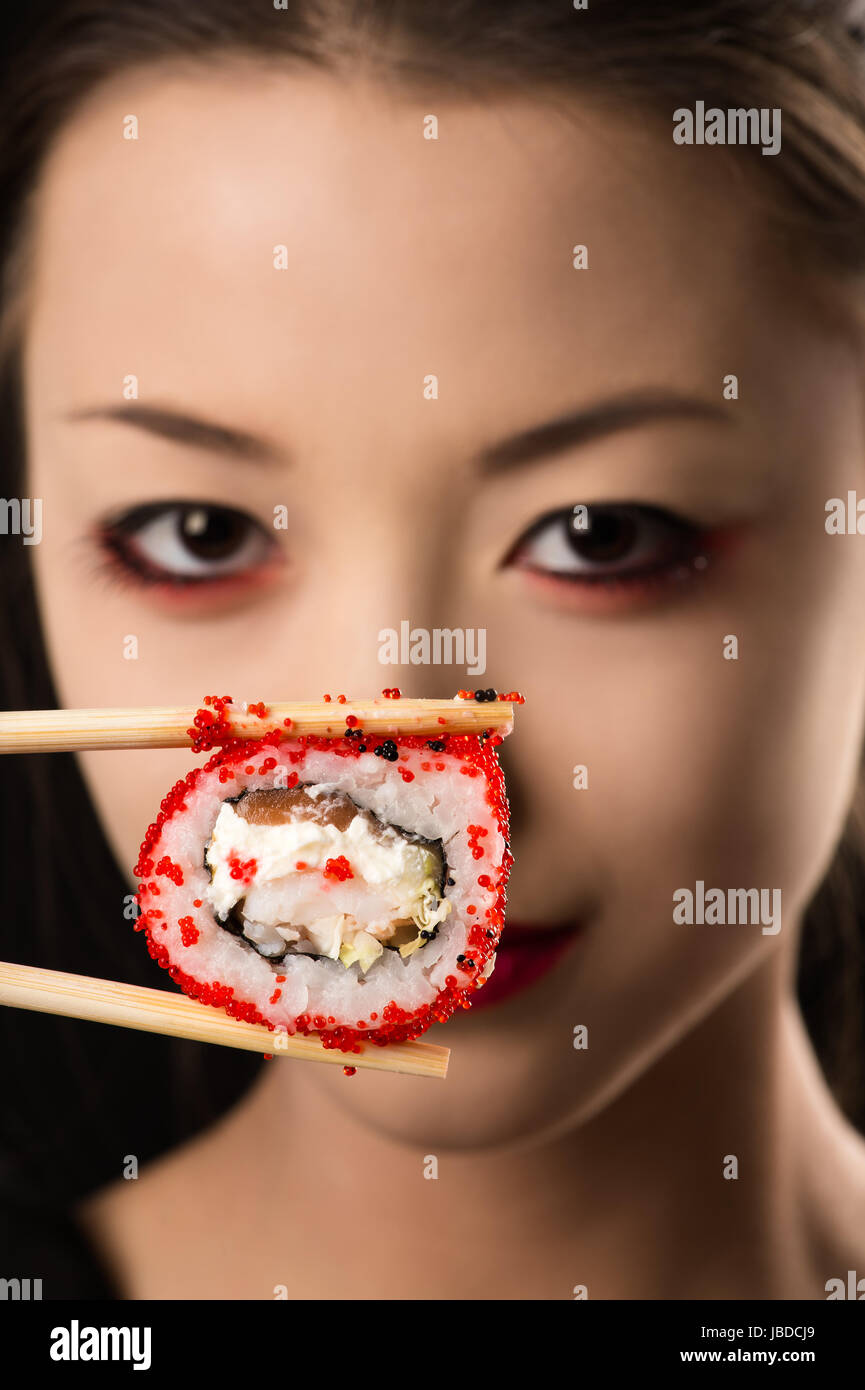 Korean girl with roll closeup Stock Photo - Alamy