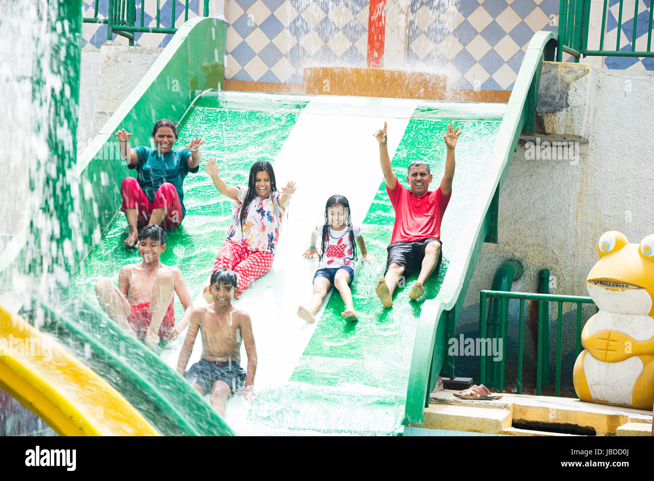 Mother daughter enjoy water slide hi-res stock photography and images ...