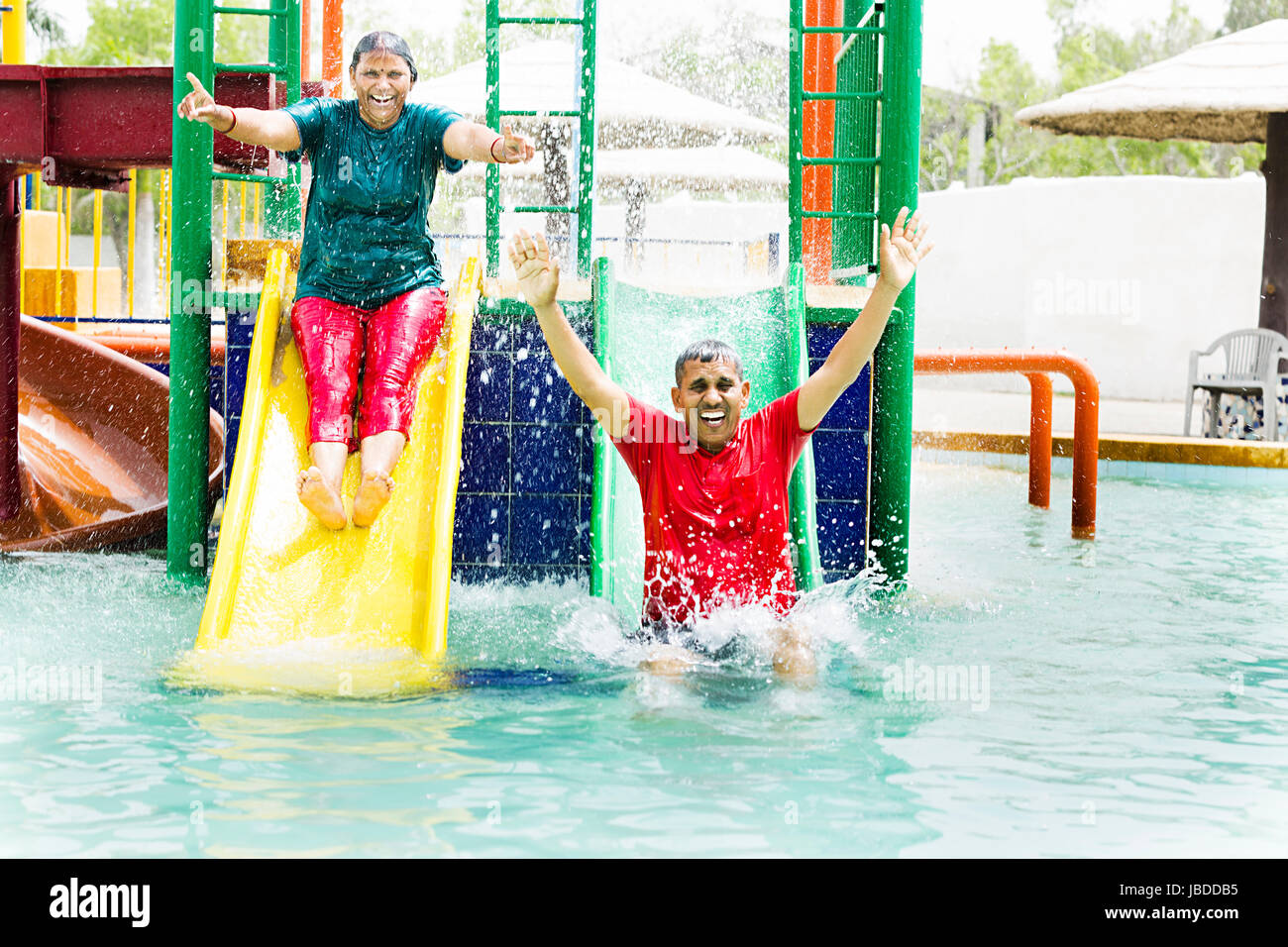 2 Senior Couple Sliding Splashing Waterpark Swimming Pool Stock Photo ...