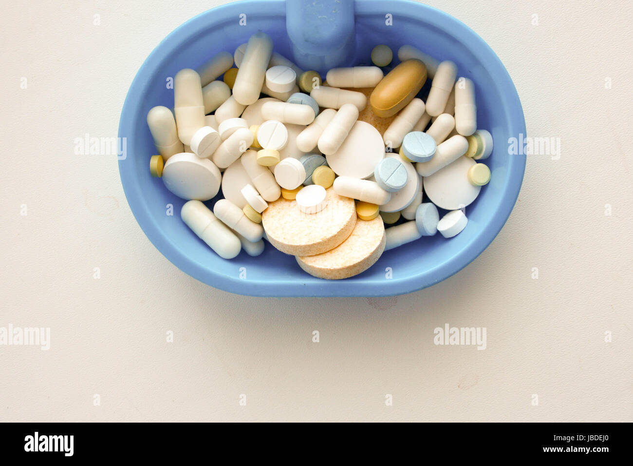 Medical tablets and capsules in a spoon. Photo for your design Stock ...