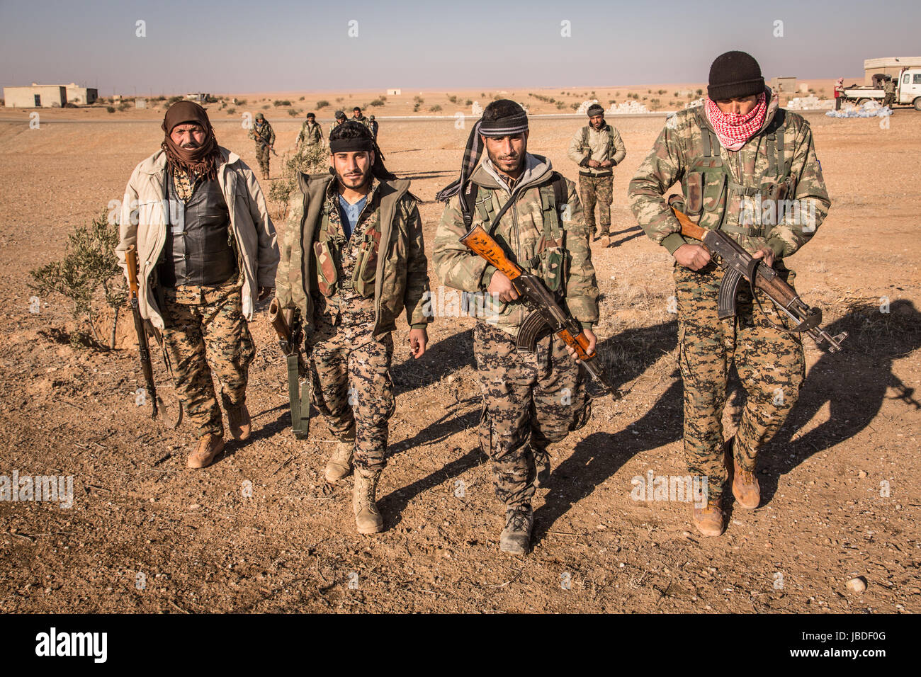 Soldier uniform rifle village desert hi-res stock photography and ...