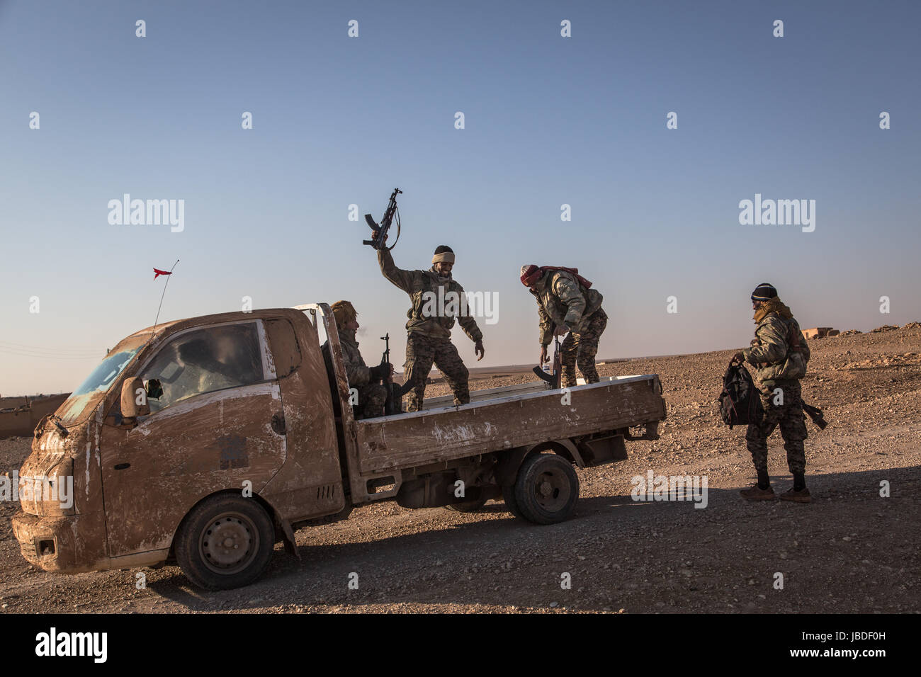 Soldier uniform rifle village desert hi-res stock photography and ...