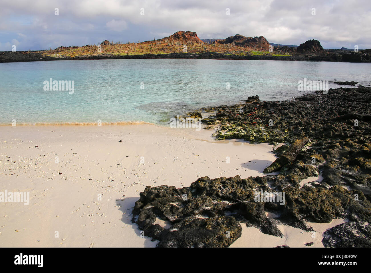 Santiago island seen from the beach of Chinese Hat island in Galapagos ...
