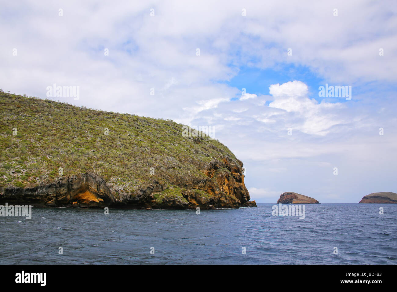 Small islands off the shore of Santiago island in Galapagos National ...