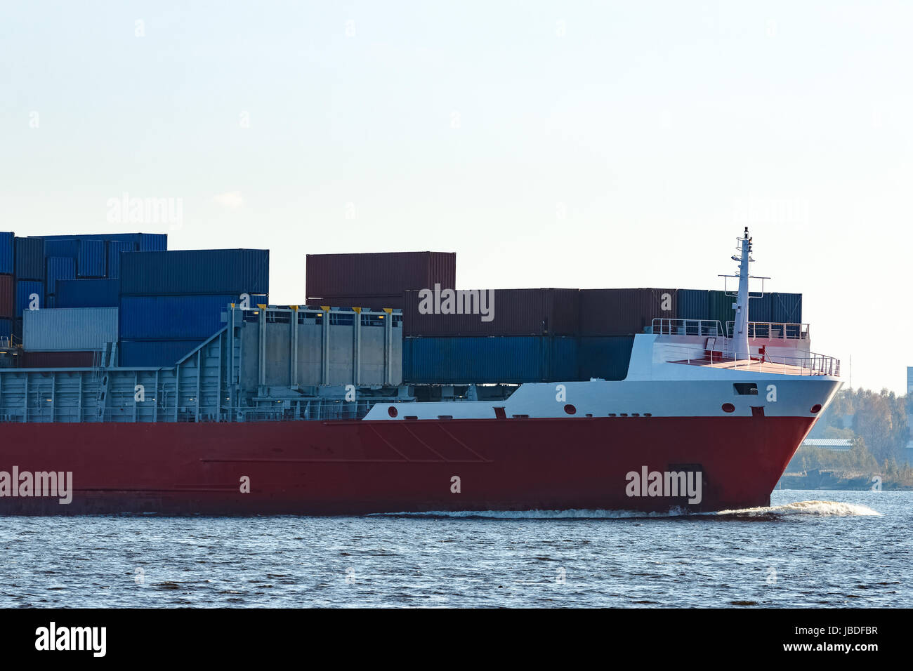 Red container ship sailing to the Baltic sea Stock Photo - Alamy