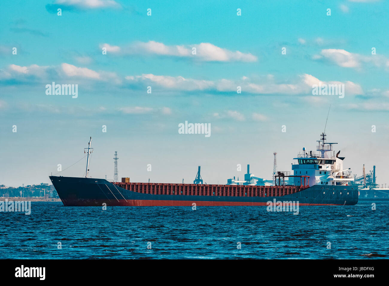 Blue cargo ship moving to the cargo port Stock Photo - Alamy