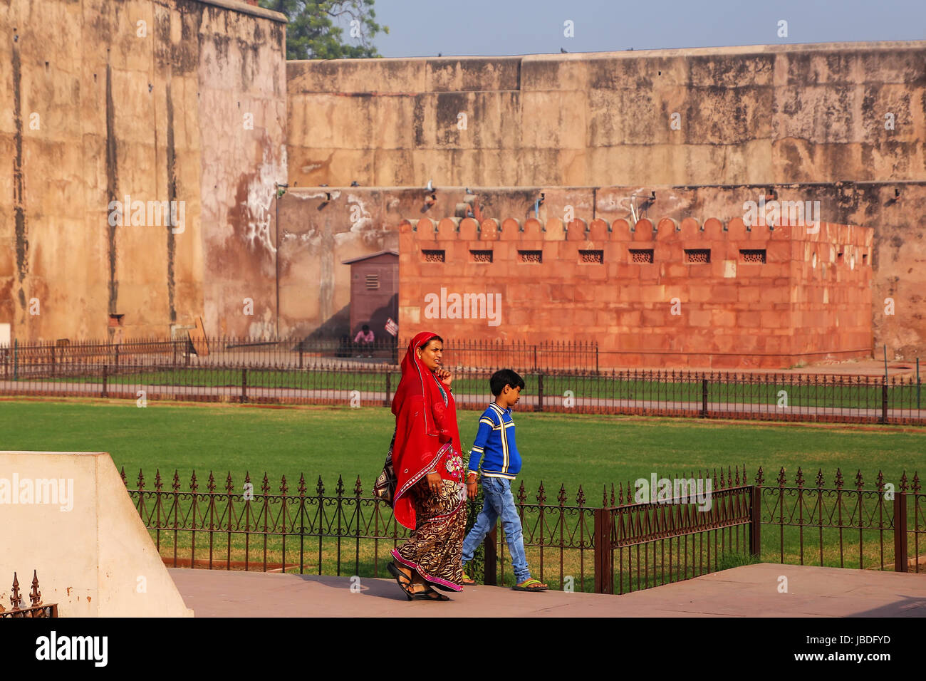 Woman with a boy waling around Agra Fort, Uttar Pradesh, India. The ...