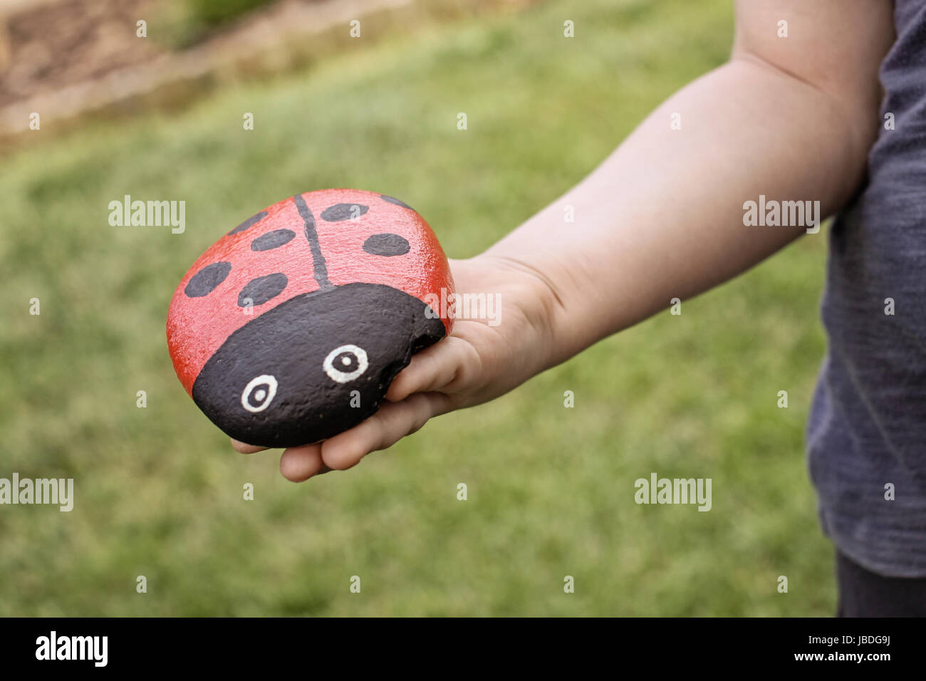 Handmade ladybird made from a painted stone Stock Photo - Alamy
