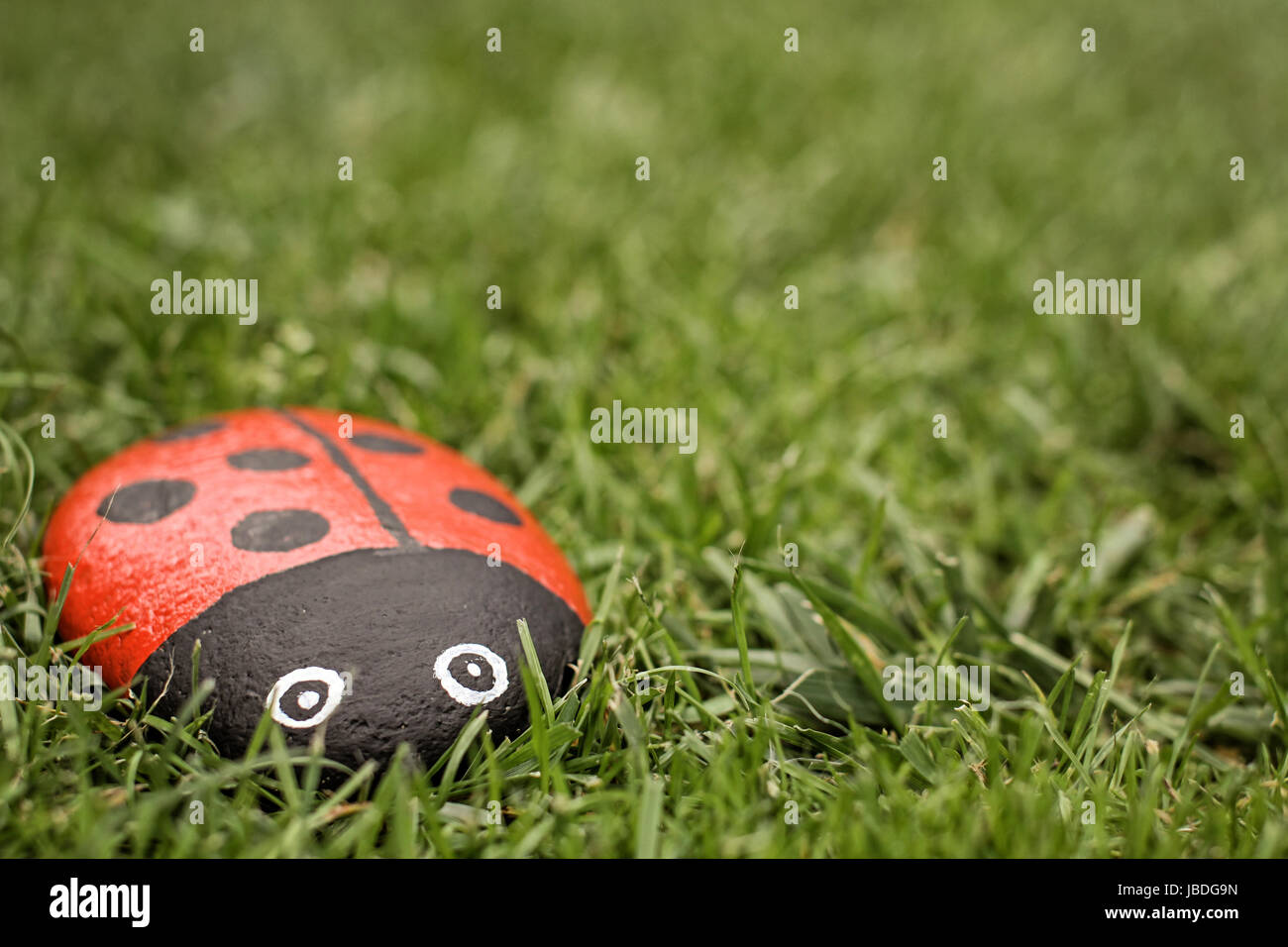 Handmade ladybird made from a painted stone Stock Photo - Alamy