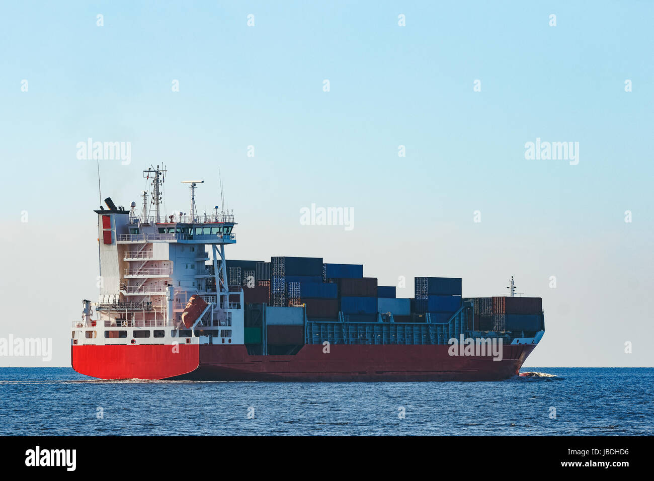 Red container ship sailing to the Baltic sea Stock Photo - Alamy
